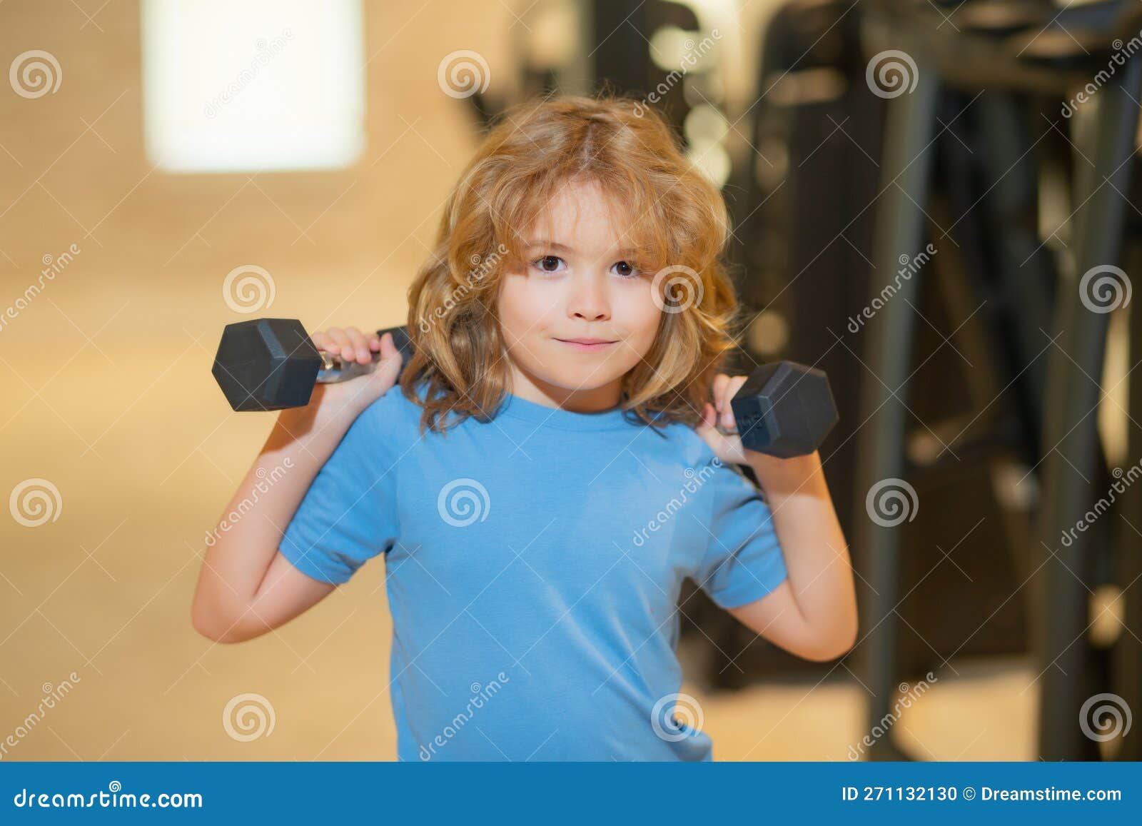 Kid Boy Working Out with Dumbbells. Sport and Kids Training. Stock ...
