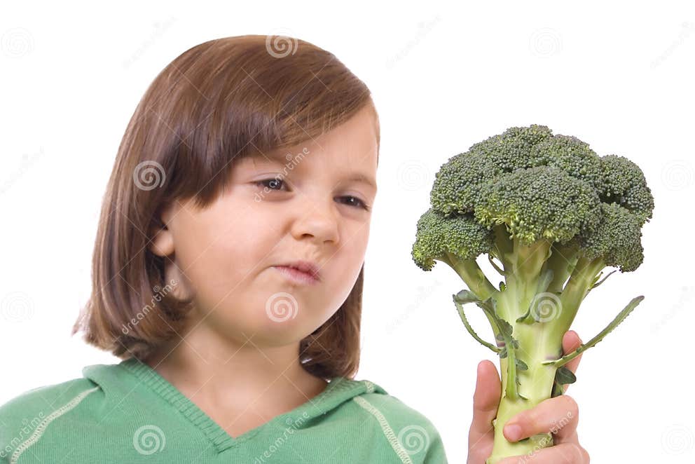 Kid with broccoli stock image. Image of unhappy, diet - 7229875