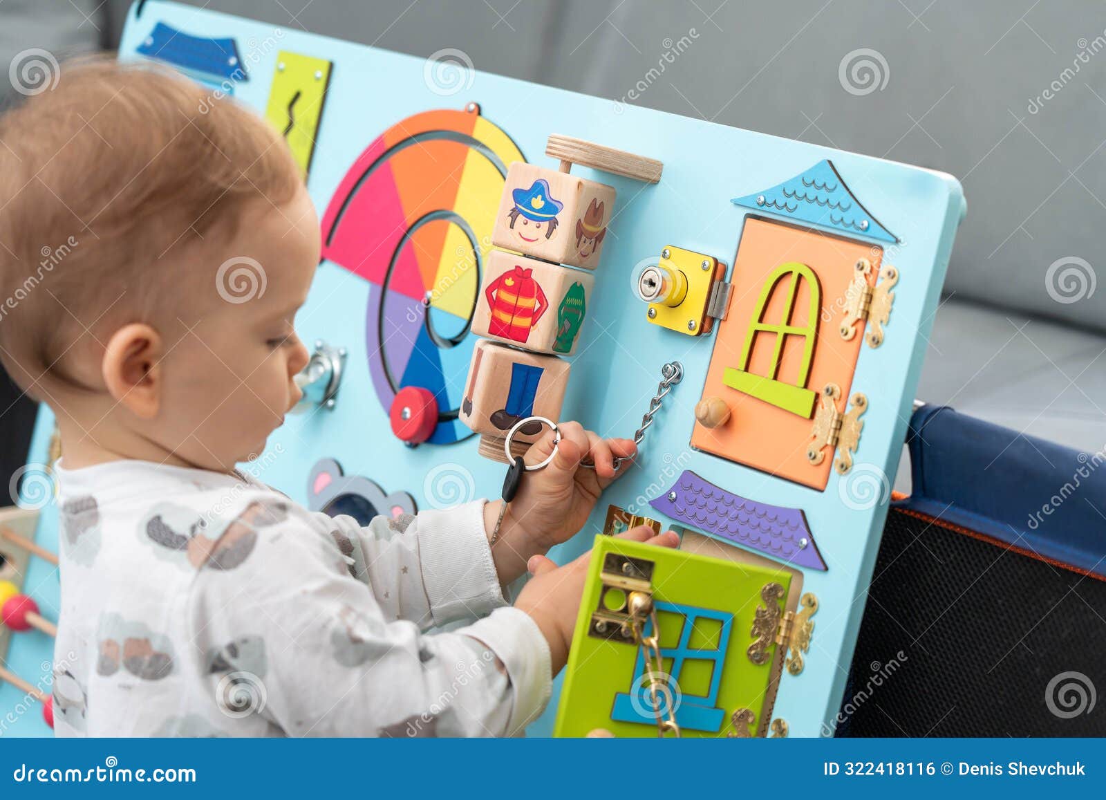 The Kid is Busy Opening the Lock with a Small Key Stock Photo - Image ...