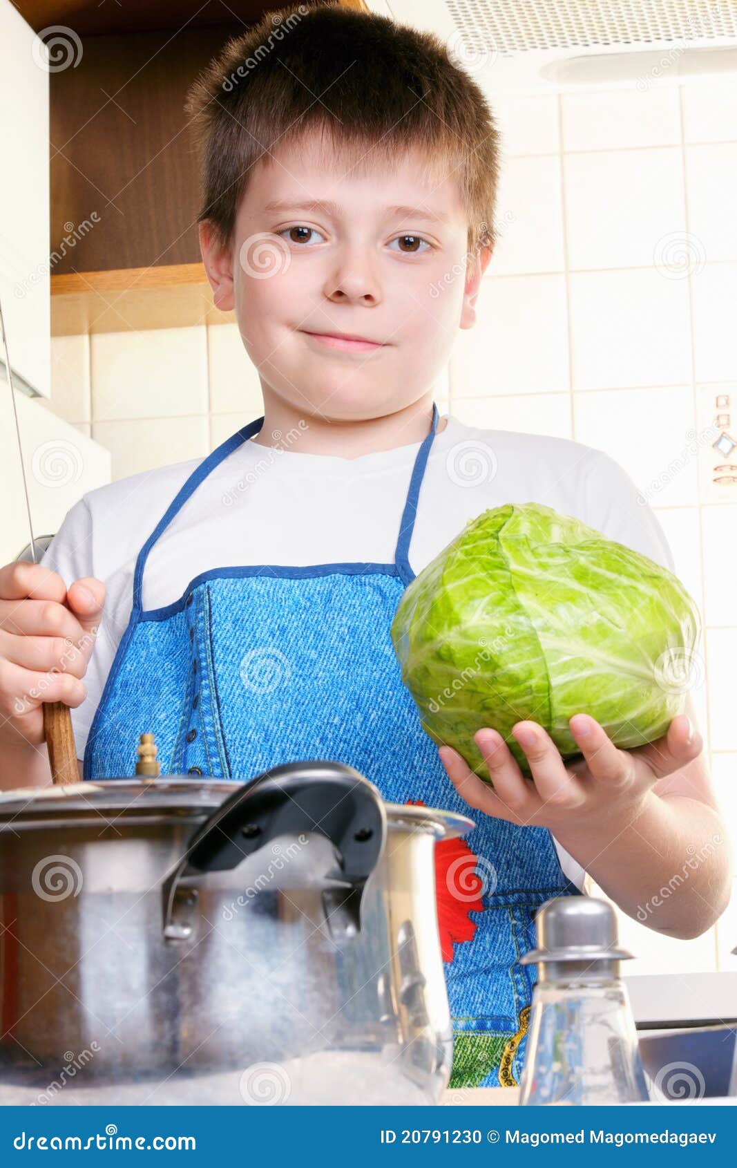 Kid with cabbage and knife stock photo. Image of male - 20791230