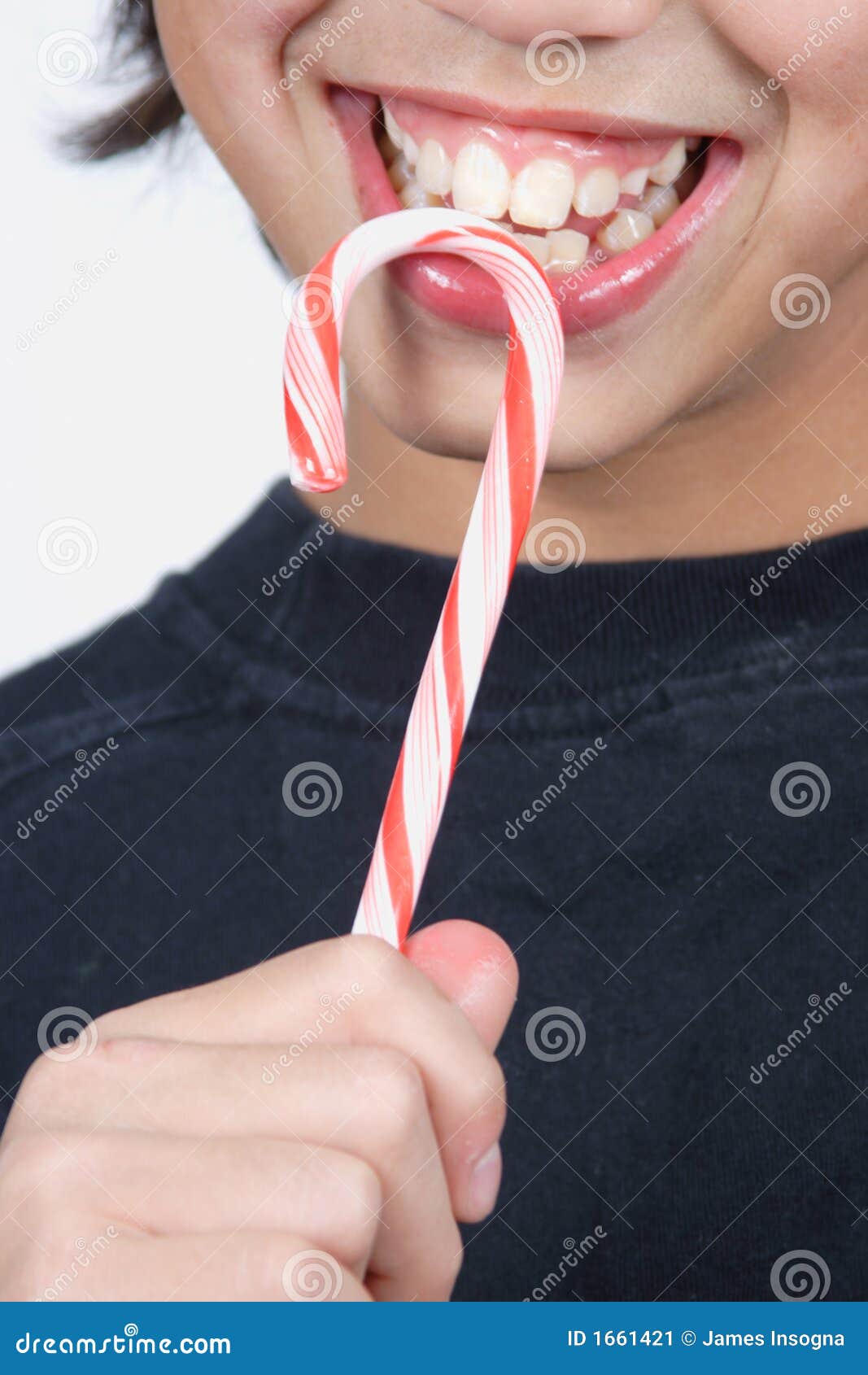 Kid and a Candy Cane stock image. Image of like, nibble - 1661421