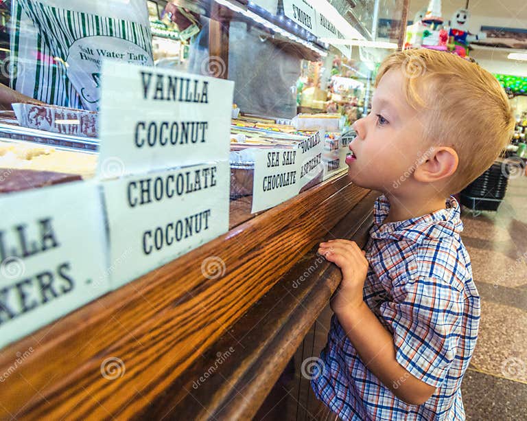 Kid in a Candy Store stock image. Image of curiously - 70922855