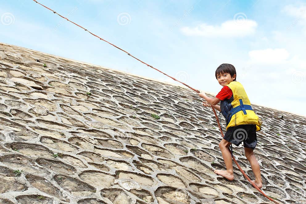 Kid climbing using rope stock image. Image of high, brave - 25856399