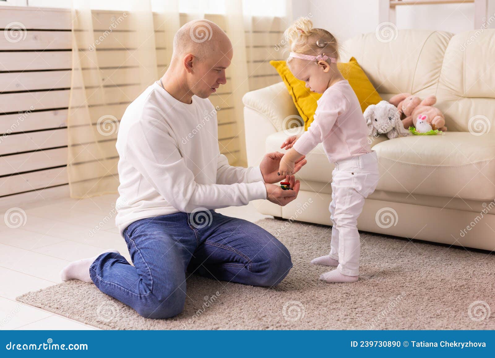 Child Girl with Cochlear Implants Playing with Toys at Home. Deafness ...