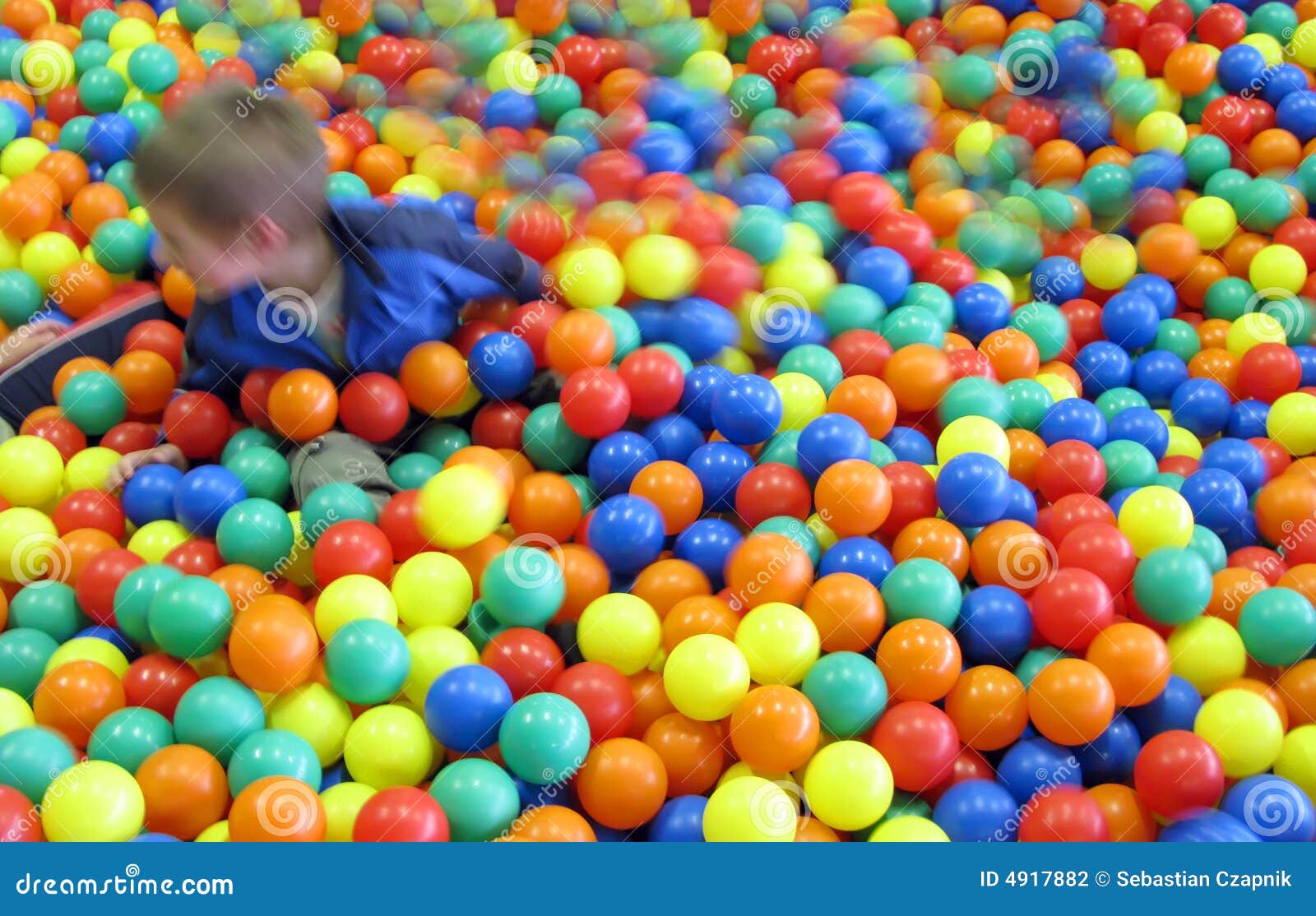 Kid in colourful fun balls stock photo. Image of child - 4917882