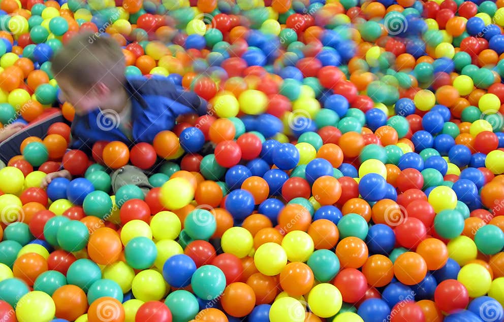 Kid in colourful fun balls stock photo. Image of child - 4917882