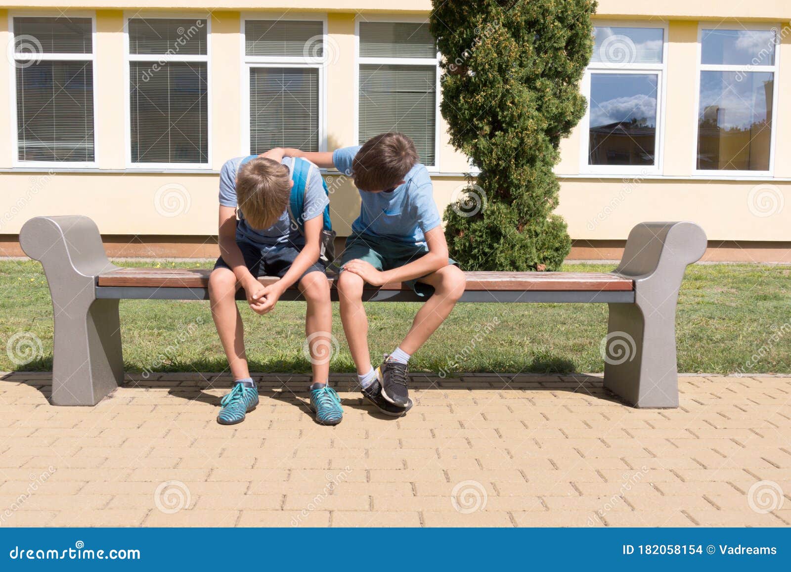 Kid Comforting Consoling Upset Sad Friend in School Yard. Problems at ...