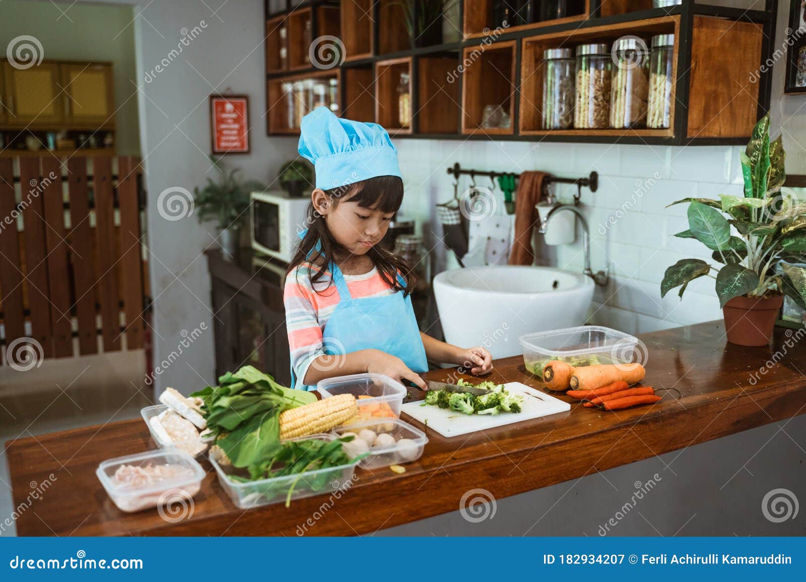 Kid cooking in the kitchen stock image. Image of healthy - 182934207