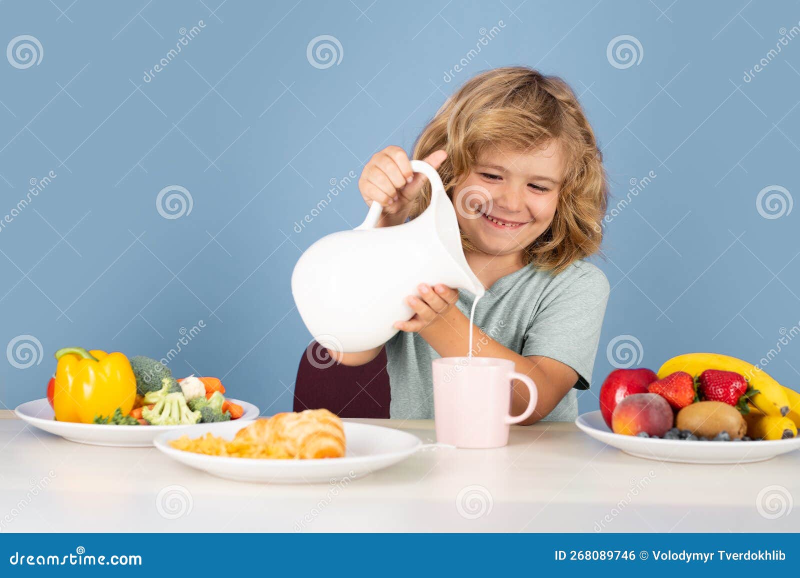 Kid with Dairy Milk. Child Having a Breakfastand Pouring Milk. Stock ...