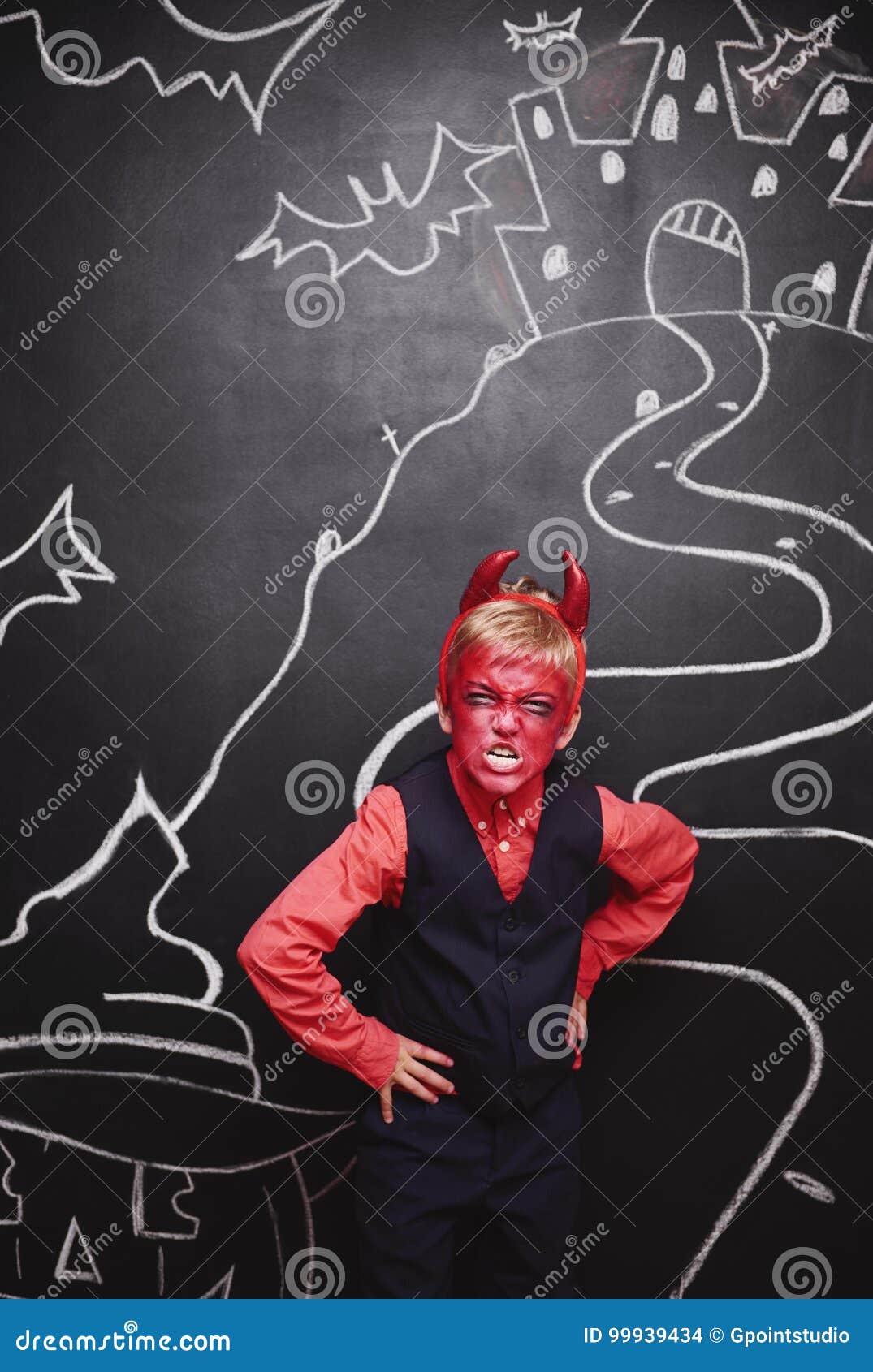 Kid in devil costume stock photo. Image of portrait, clenching - 99939434