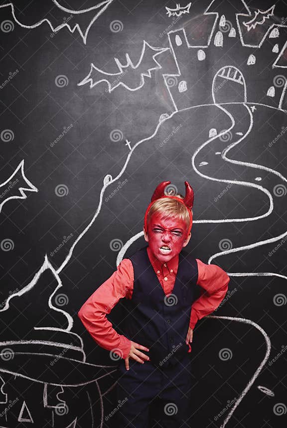 Kid in devil costume stock photo. Image of portrait, clenching - 99939434