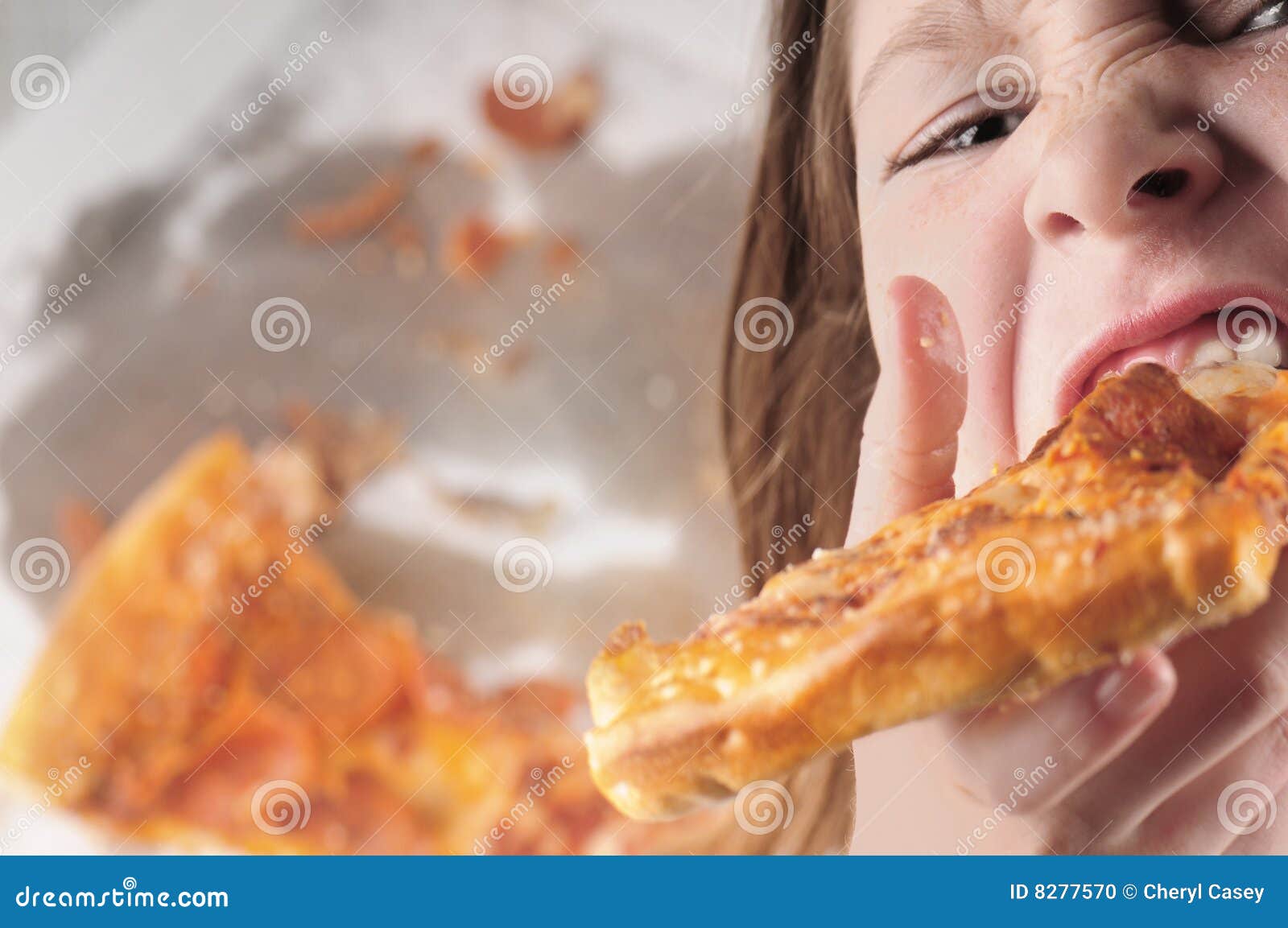 Kid devouring pizza stock photo. Image of funny, dinner - 8277570