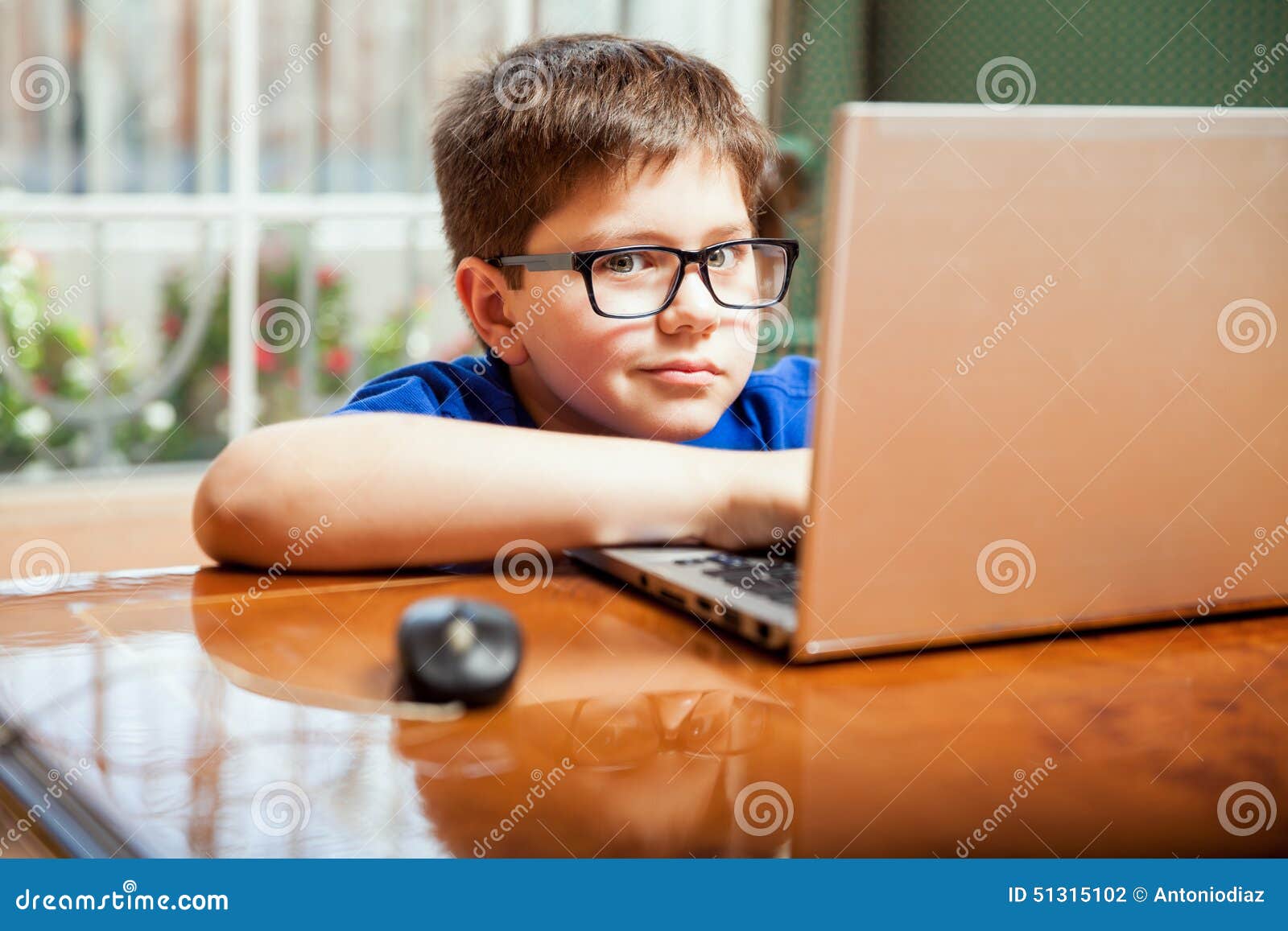 Kid Doing Homework on a Laptop Stock Photo - Image of internet ...