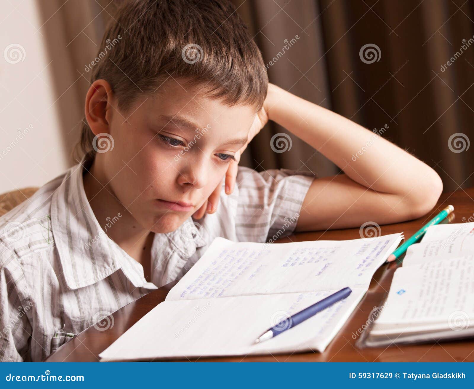 Kid doing homework stock image. Image of hands, book - 59317629
