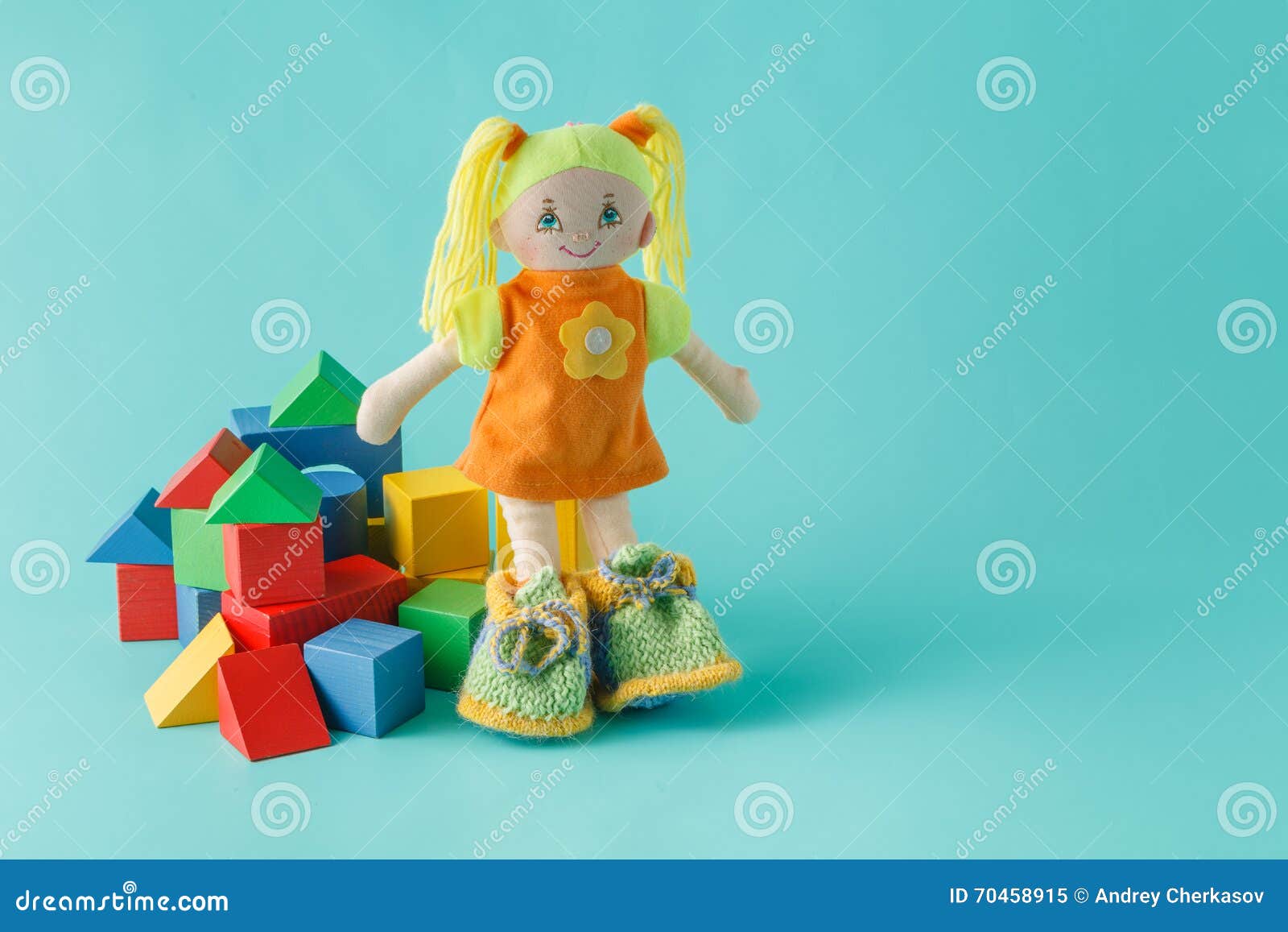Kid Doll with Wooden Building Blocks on Plain Background Stock Image ...