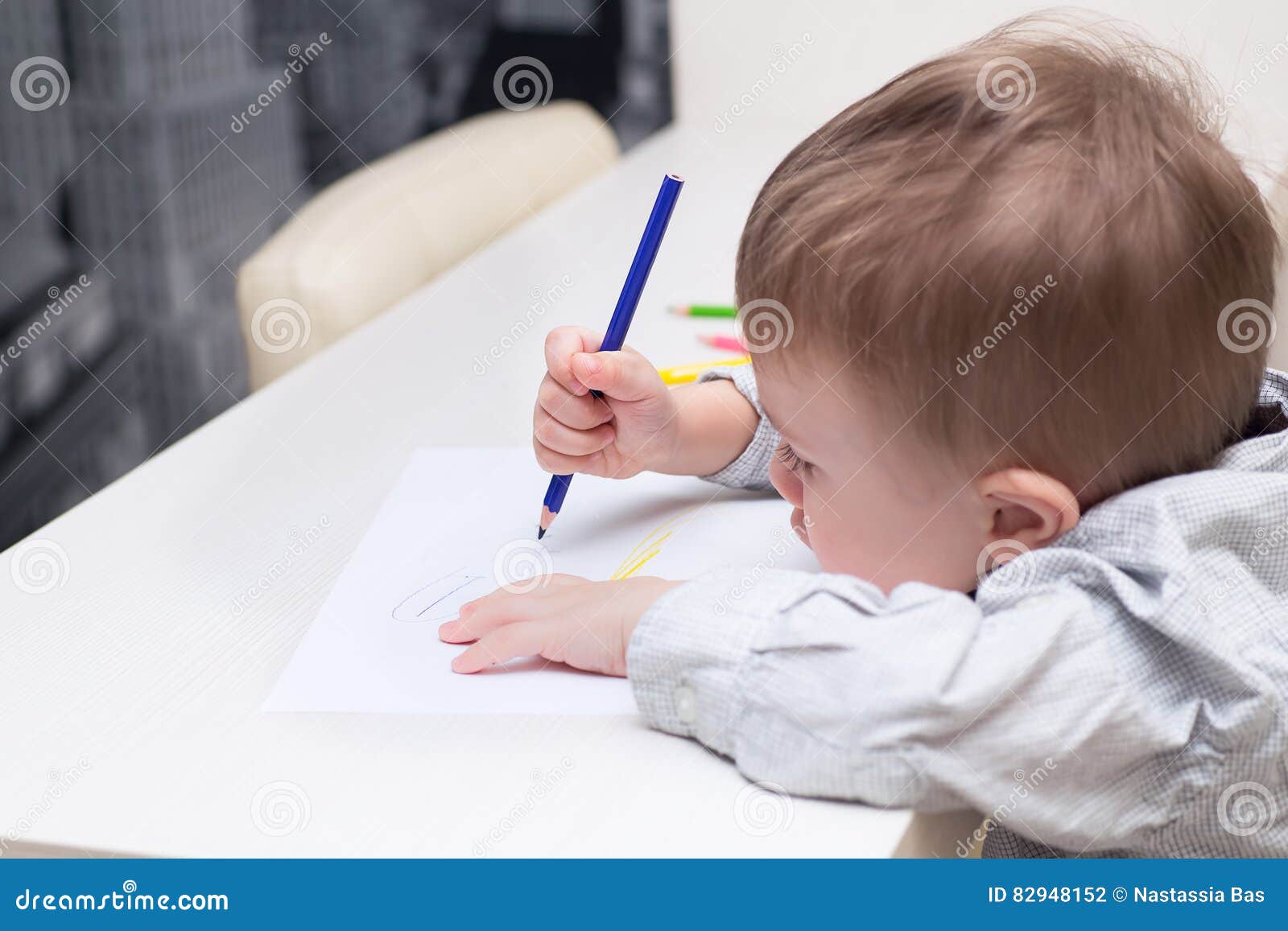 Kid Drawing with Pencils on Paper on a White Table Stock Photo - Image ...