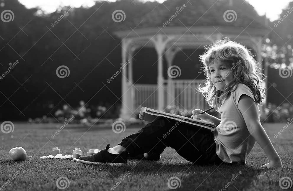 Kid Draws in Park Having Fun on Nature Background. Children Creative ...