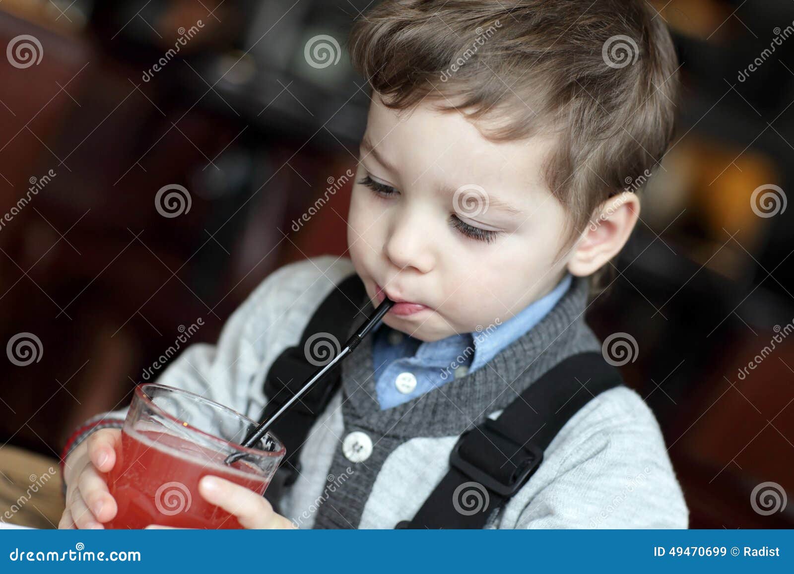 Kid drinking red juice stock image. Image of face, human - 49470699
