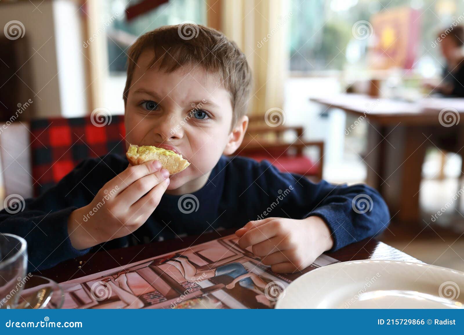 Kid Eating Bun with Butter in Cafe Stock Photo - Image of appetizing ...