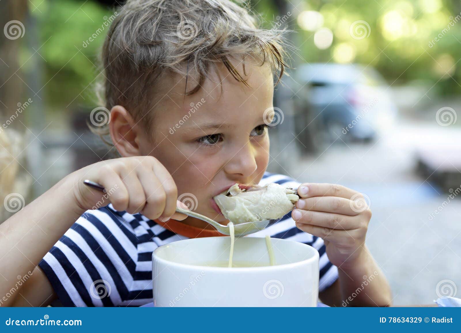 Kid eating chicken soup stock image. Image of breakfast - 78634329
