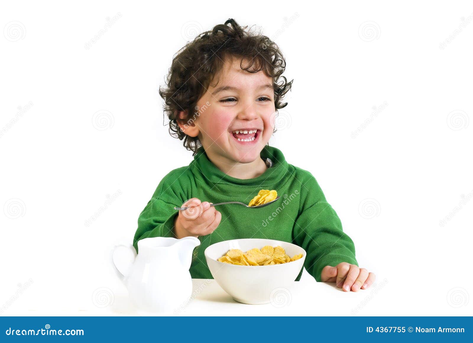 Kid eating cornflakes stock image. Image of funny, feeding - 4367755