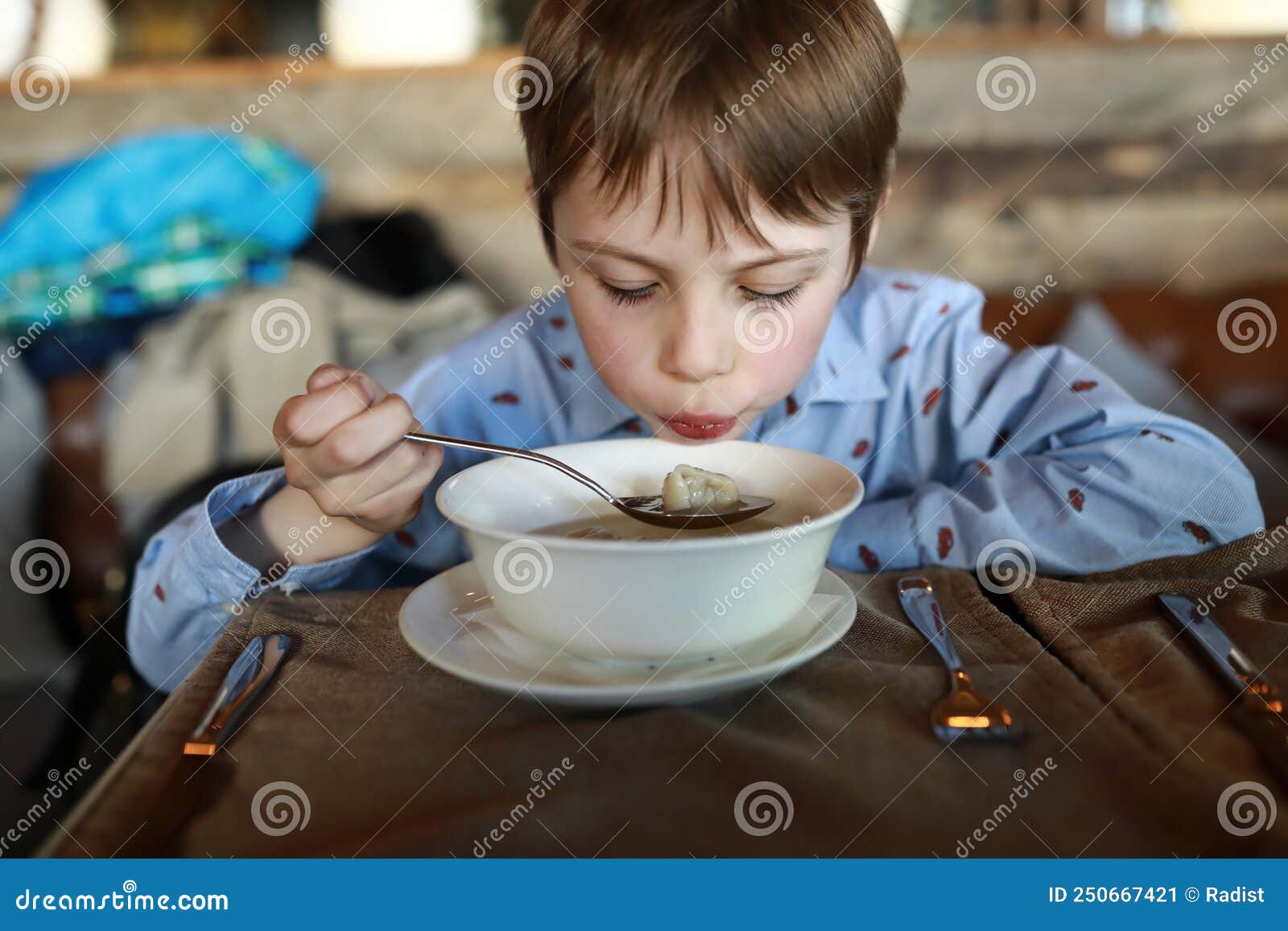 Kid Eating Dumplings with Broth Stock Image - Image of cafeteria ...