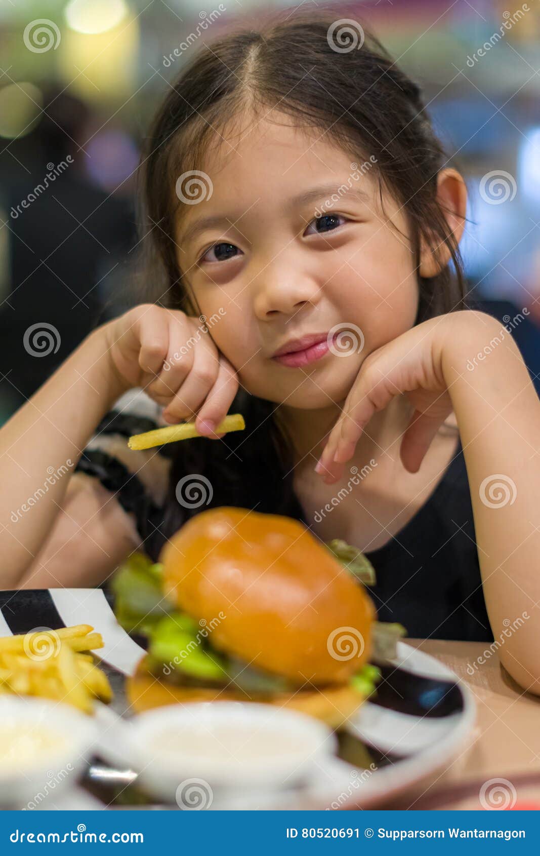 Kid Eating Hamburger stock image. Image of restaurant - 80520691