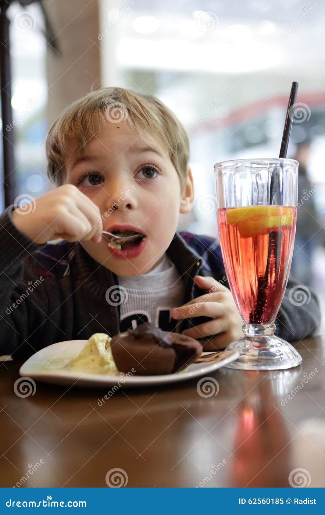 Kid eating ice cream stock image. Image of cheerful, cute - 62560185