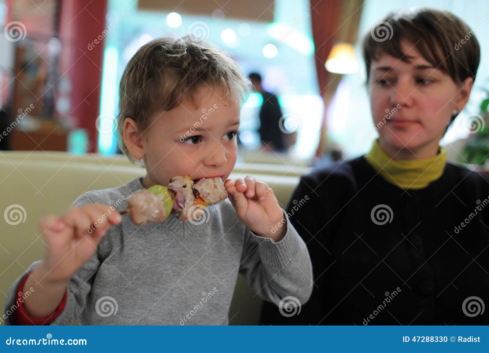 Kid eating kebab stock photo. Image of childhood, indoor - 47288330