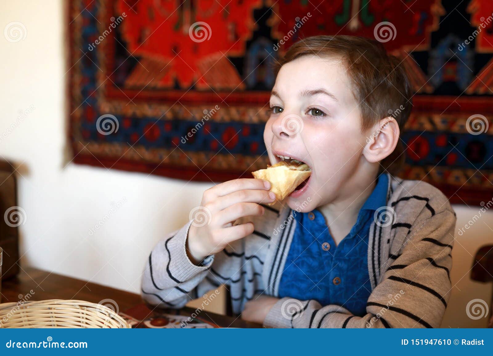 Kid eating khachapuri stock photo. Image of fresh, khachapuri - 151947610