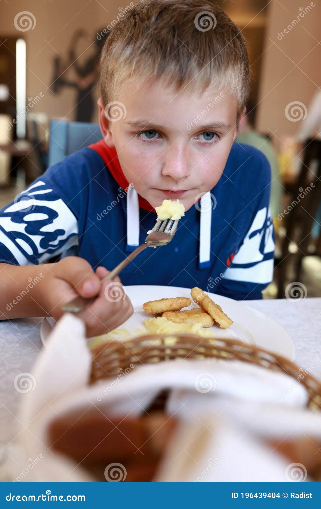 Kid Eating Nuggets with Mashed Potatoes Stock Photo - Image of eating ...