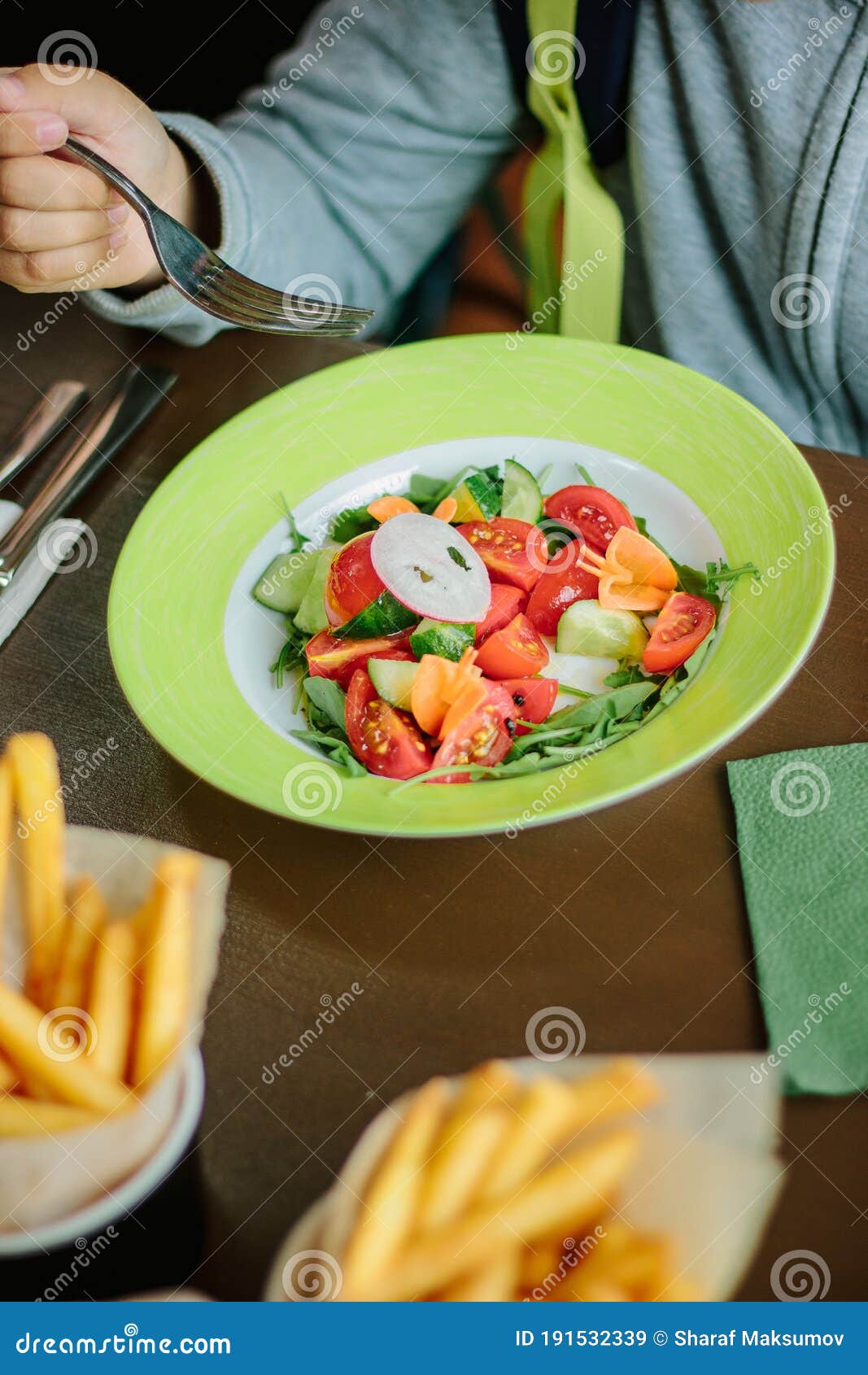 Kid eating salad. stock image. Image of kitchen, table - 191532339