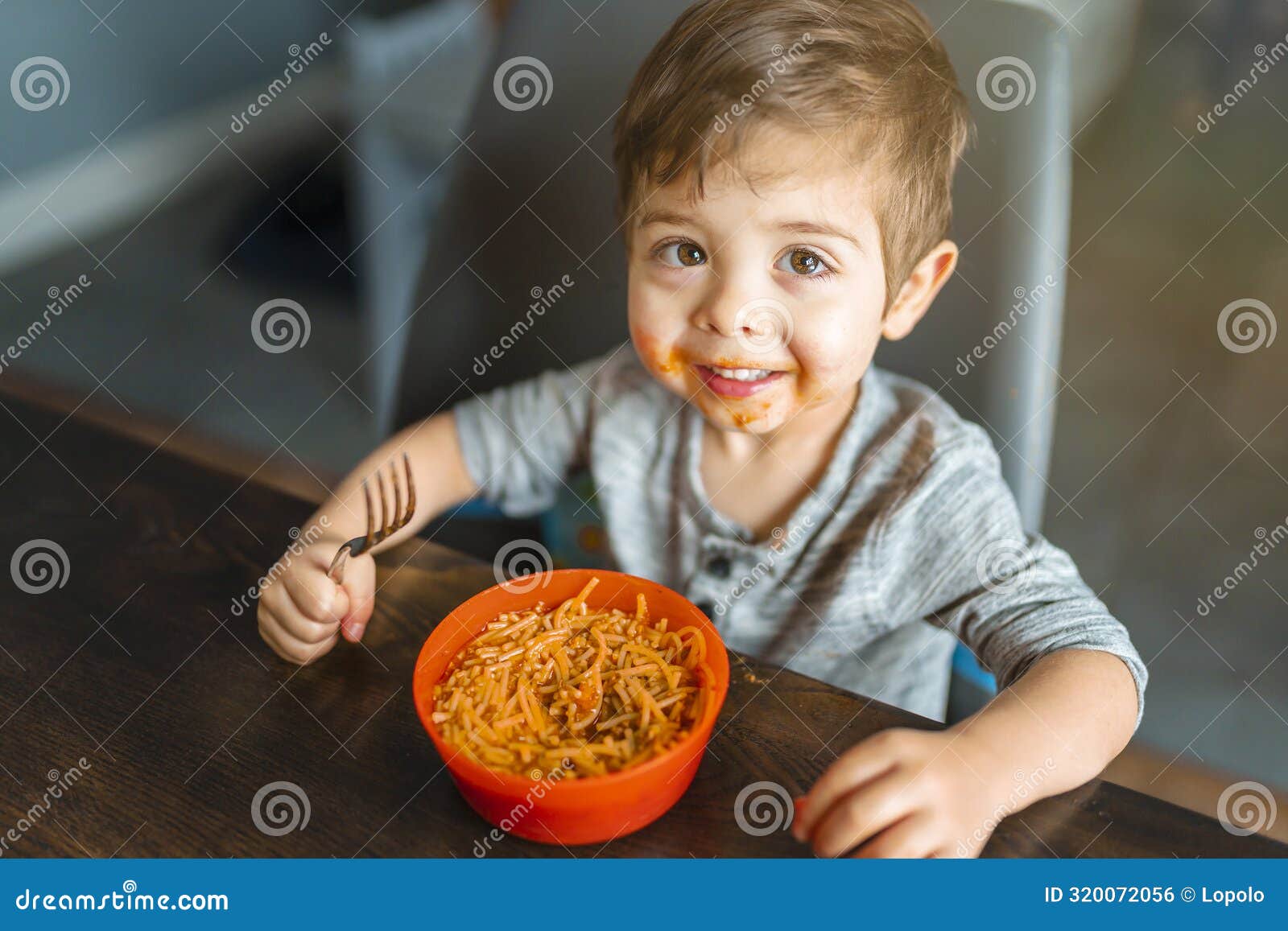Kid Eating Spaghetti in the Kitchen Having Fun Stock Photo - Image of ...