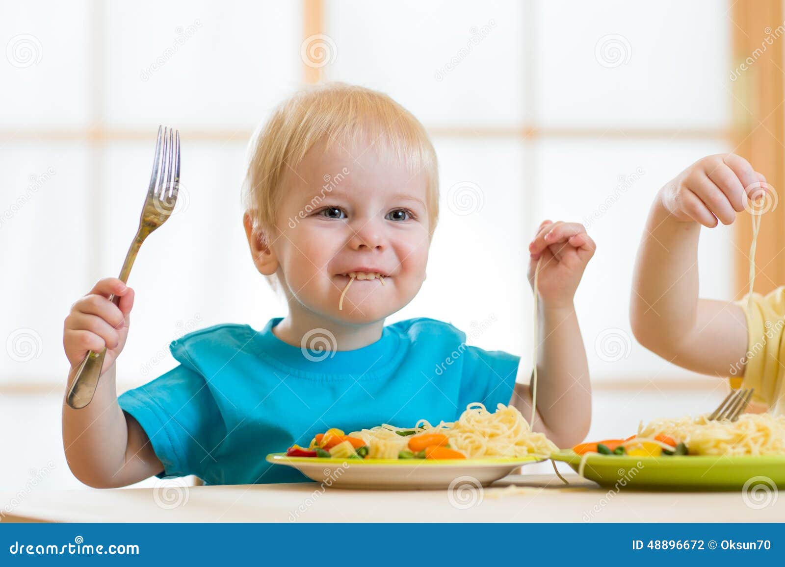 Kid Eating Spaghetti with Vegetables in Nursery Stock Photo - Image of ...