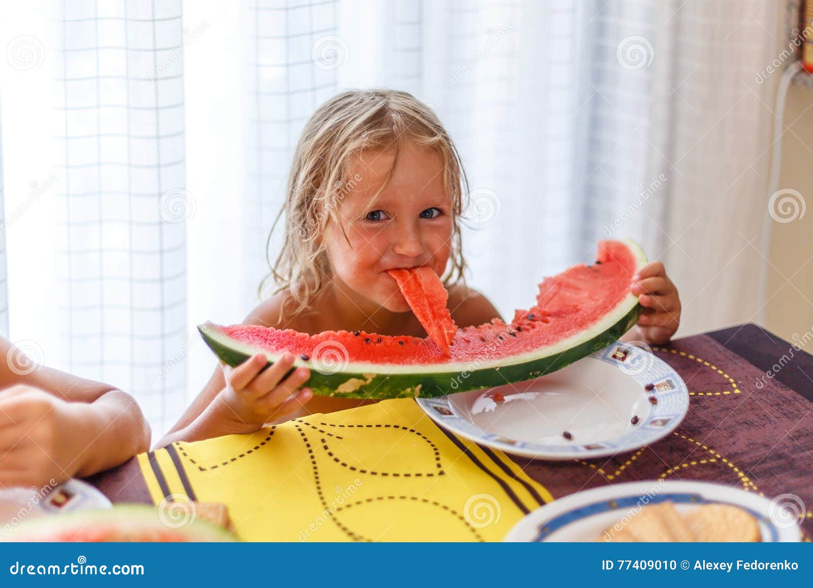 Kid eating watermelon stock photo. Image of table, lunch - 77409010