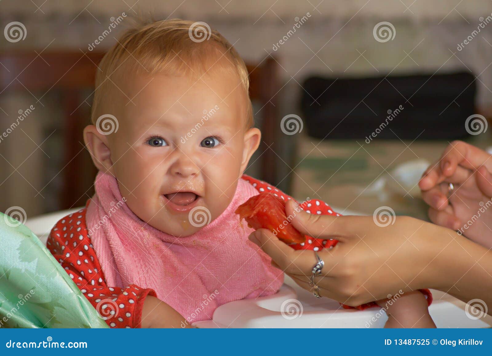 Kid eats tomatoes stock image. Image of baby, worried - 13487525