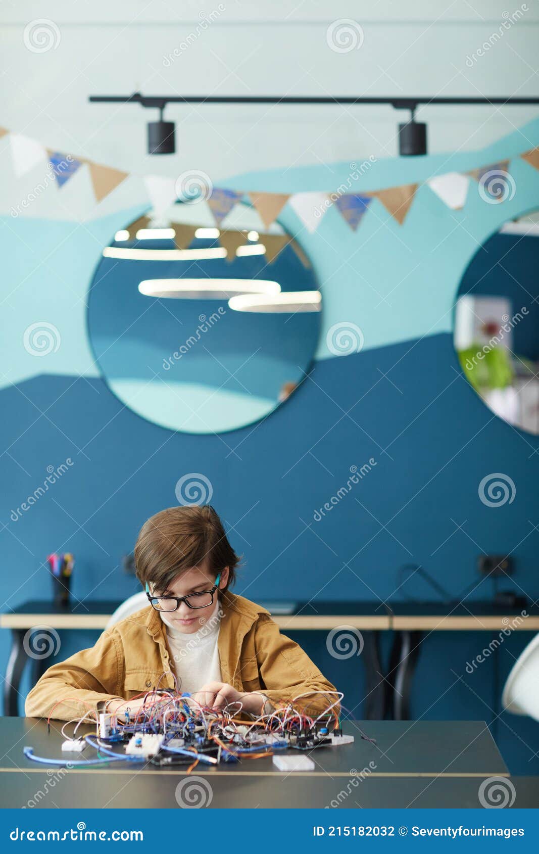 Kid in Engineering Class stock photo. Image of robot - 215182032