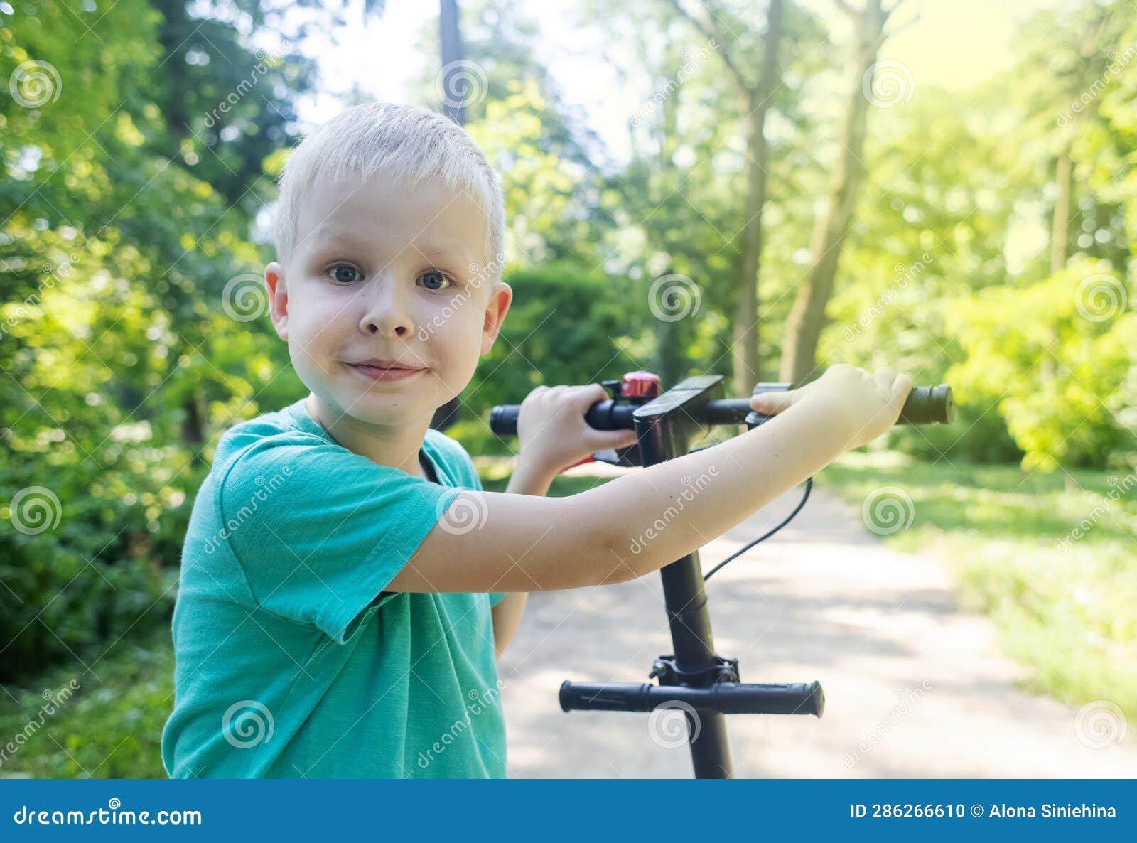 Kid Fall when Riding an Electric Scooter. Riding an E-scooter without ...