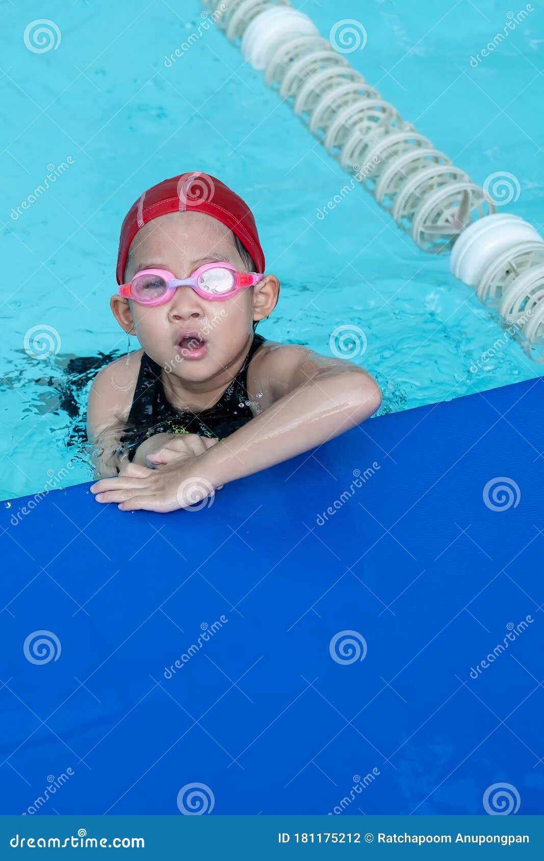 A Kid Feels Tired in Swimming Class in the Swimming Pool Stock Photo ...