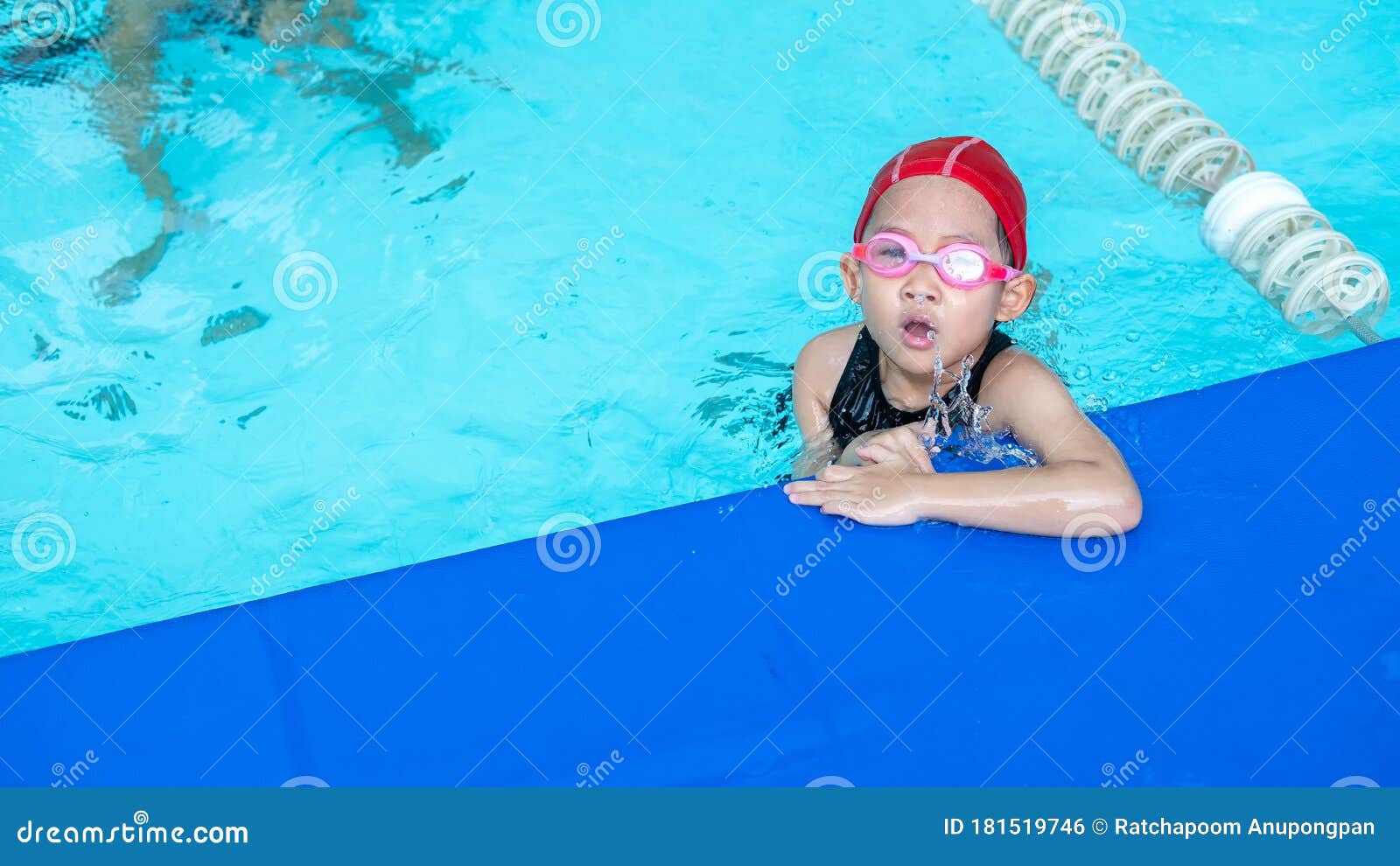 A Kid Feels Tired in Swimming Class in the Swimming Pool Stock Photo ...