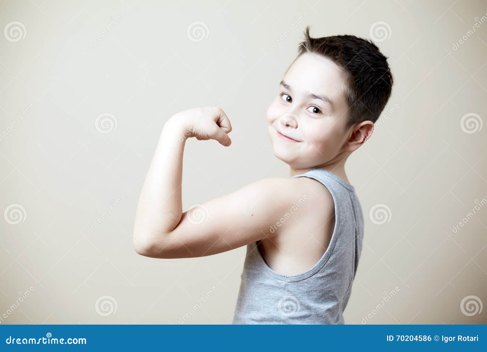Kid flexing biceps stock photo. Image of bodybuilder - 70204586