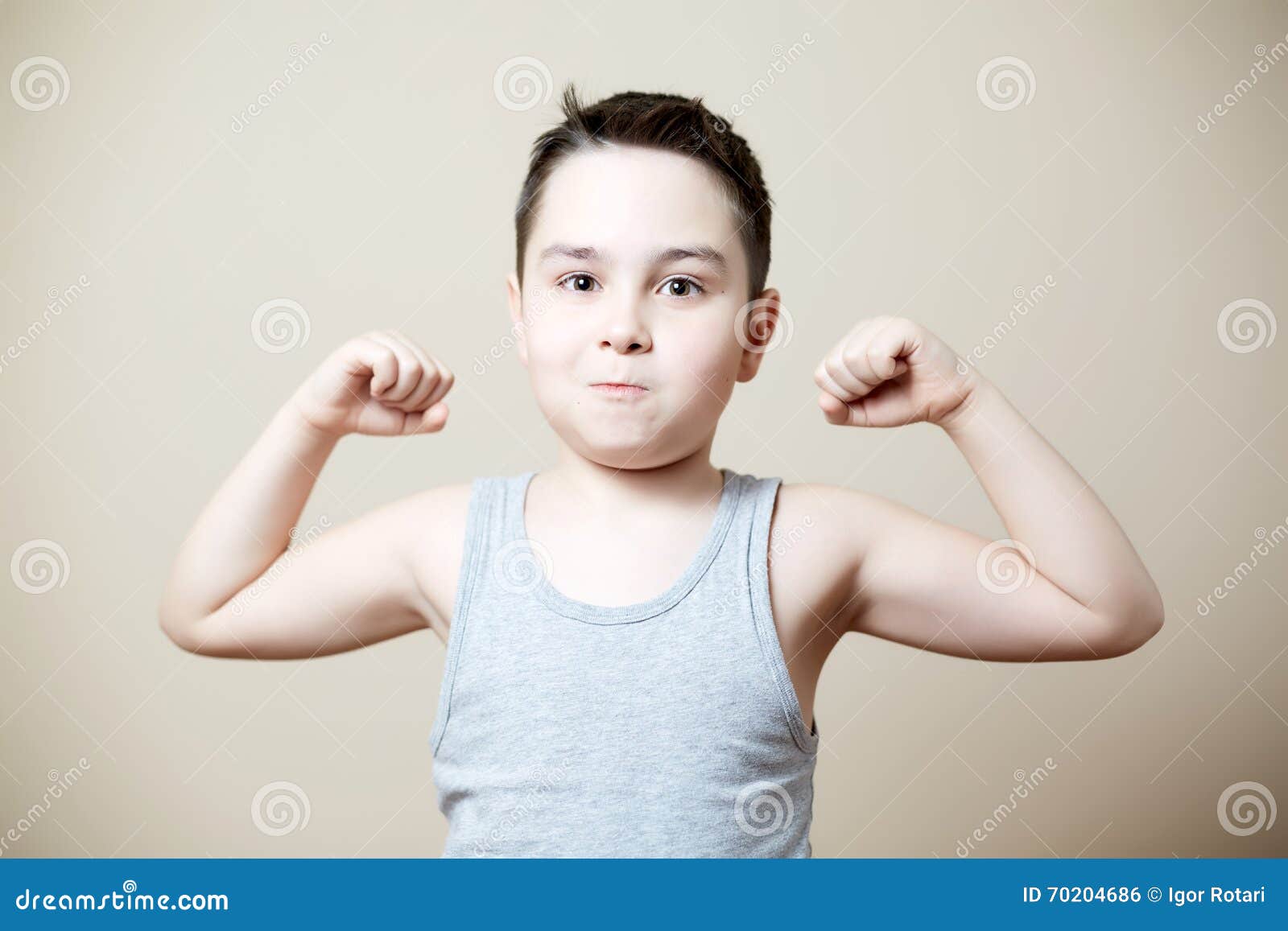 Kid flexing biceps stock photo. Image of child, bodybuilder - 70204686