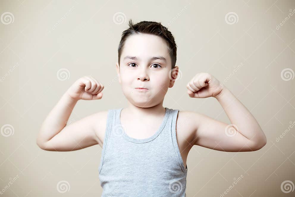 Kid flexing biceps stock photo. Image of child, bodybuilder - 70204686