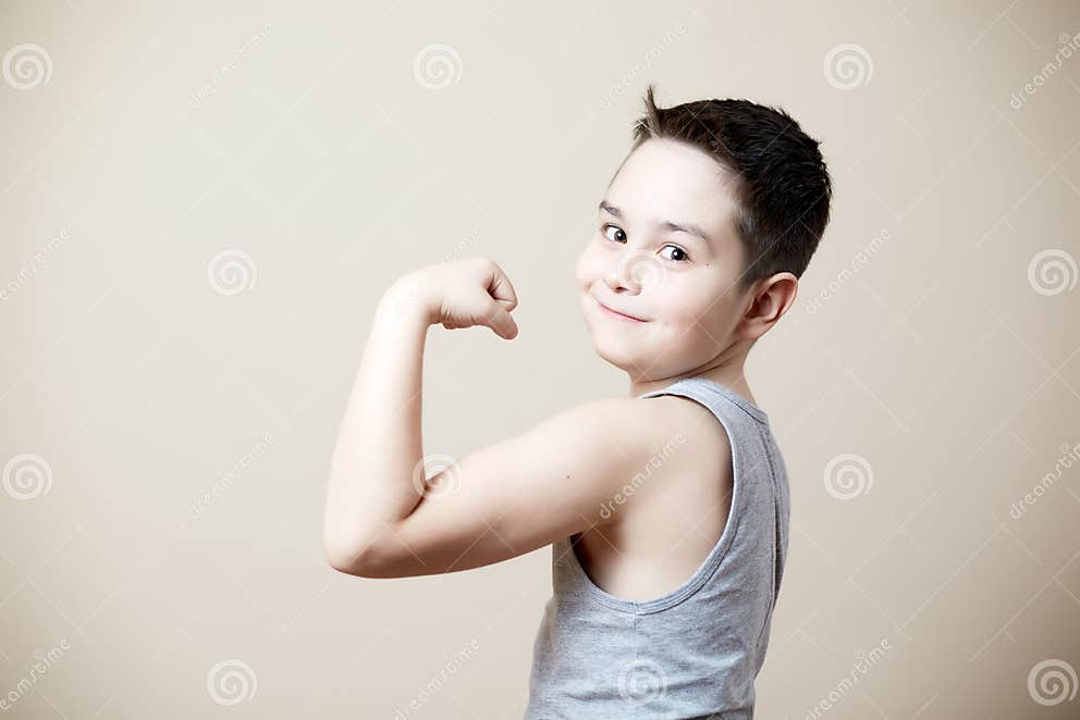 Kid flexing biceps stock photo. Image of body, bodybuilding - 70204762