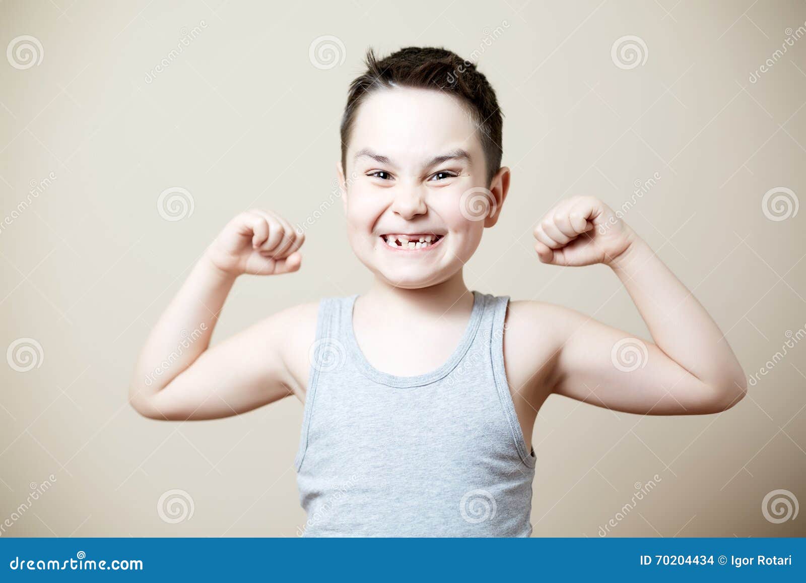 Kid flexing biceps stock photo. Image of bodybuilder - 70204434