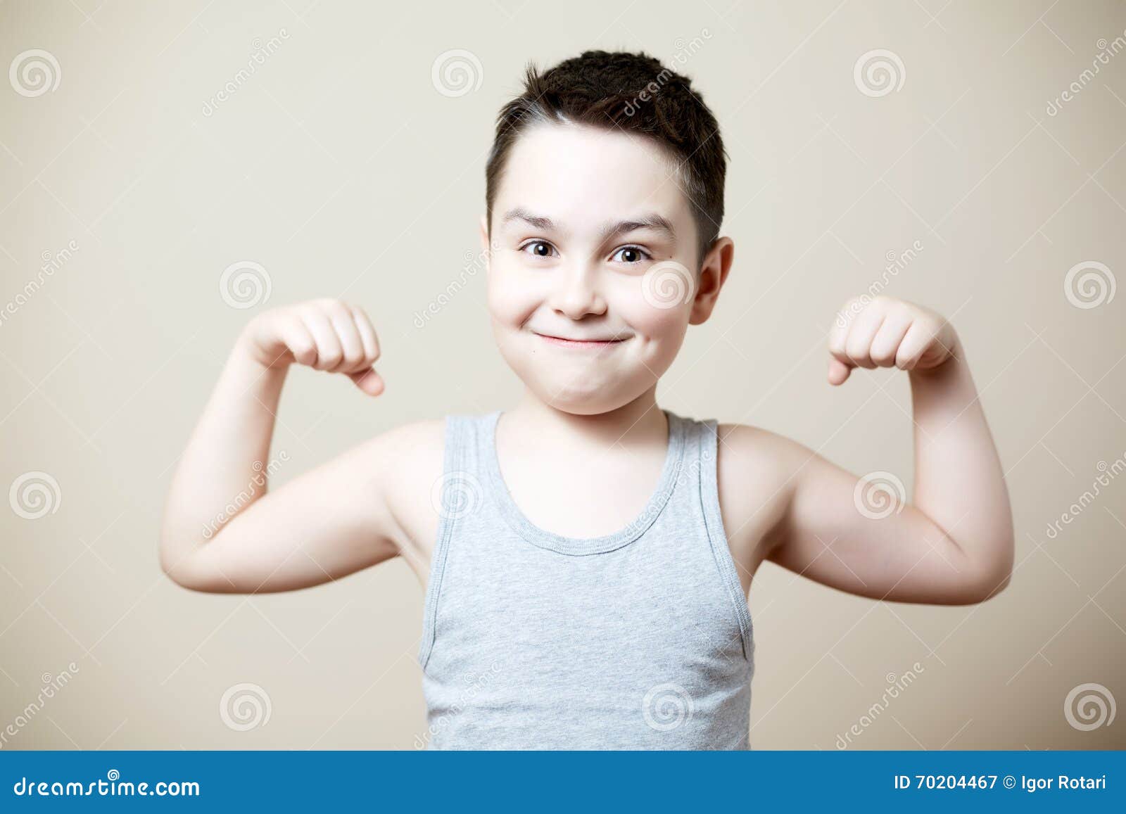 Kid flexing biceps stock image. Image of muscle, emotionally - 70204467