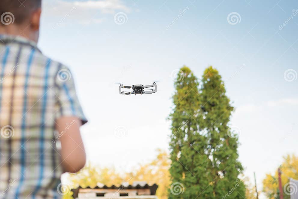 Kid Flying Drone. Boy Operate Drones Stock Photo - Image of model ...