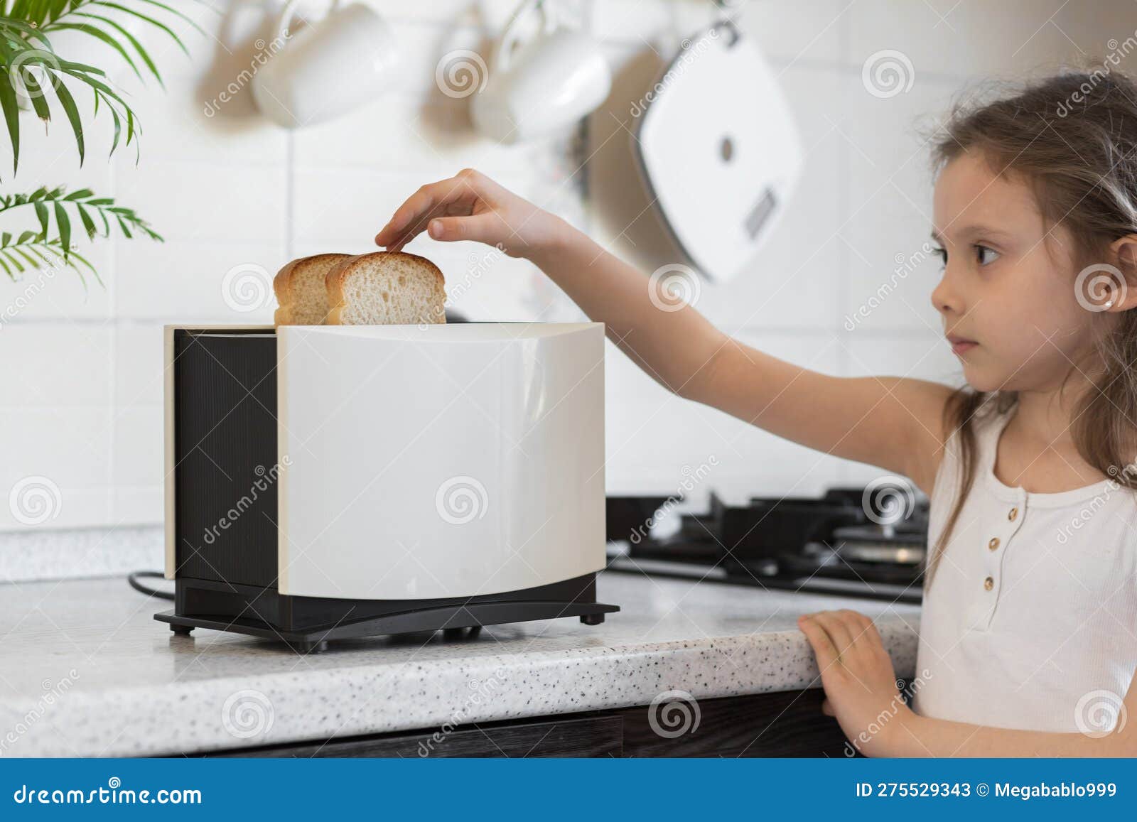 Kid Girl Cooking on Kitchen. White Toaster with Sliced Bread Stands on ...