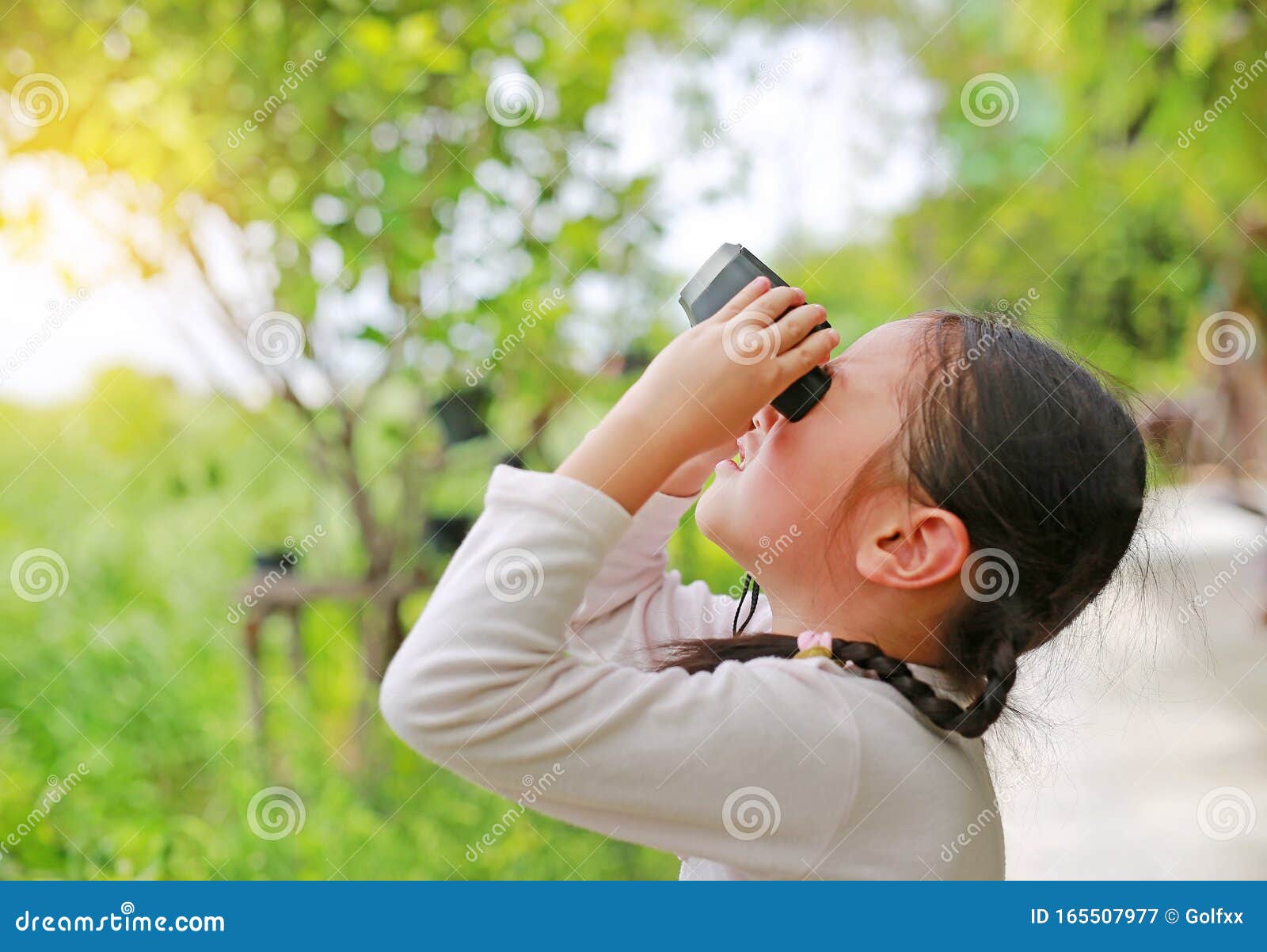 Kid Girl Kid Looking Ahead with Binoculars in Nature Fields. Explore ...
