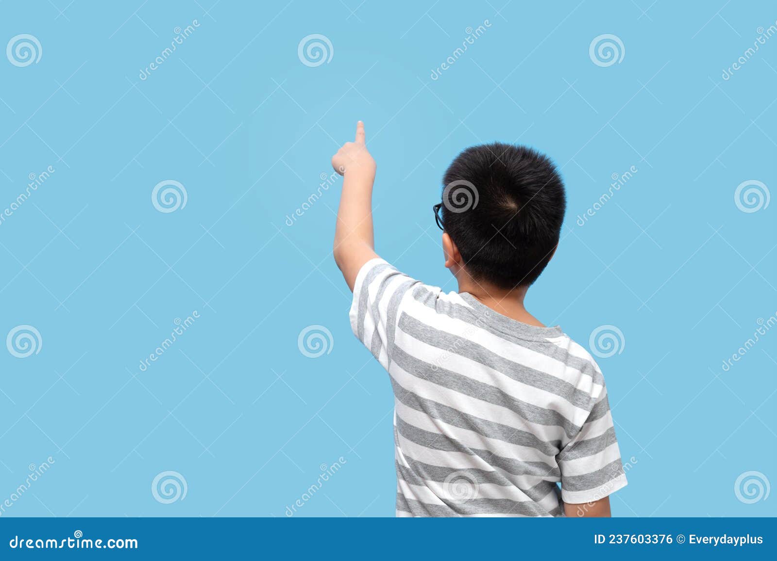 Kid with Glasses and Finger Pointing Upwards, Back View Stock Photo ...